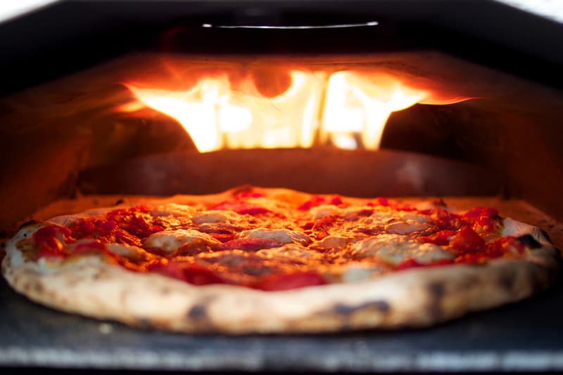 This Portable Pizza Oven Uses Wood Pellets to Cook a Pizza in Two ...