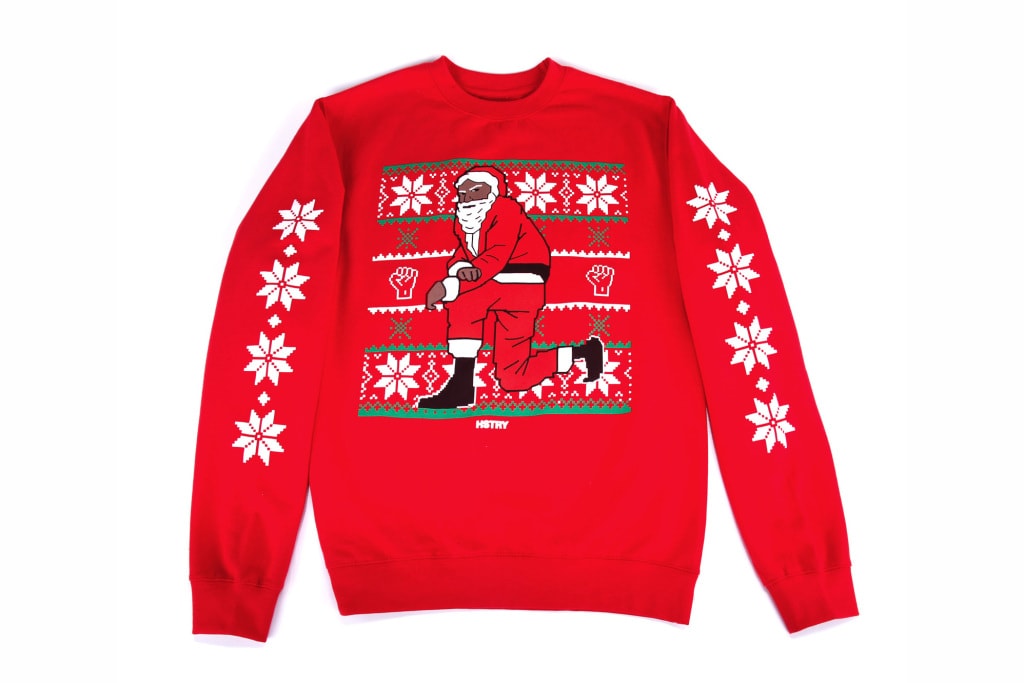 Nas Kneeling Santa Sweaters | Hypebeast