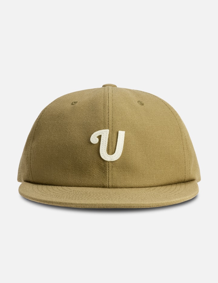 Unlikely Unlikely Team Cap - 日本製米色6片帽，前方繡「U」貼片，背部可調，附貼紙徽章 | HBX