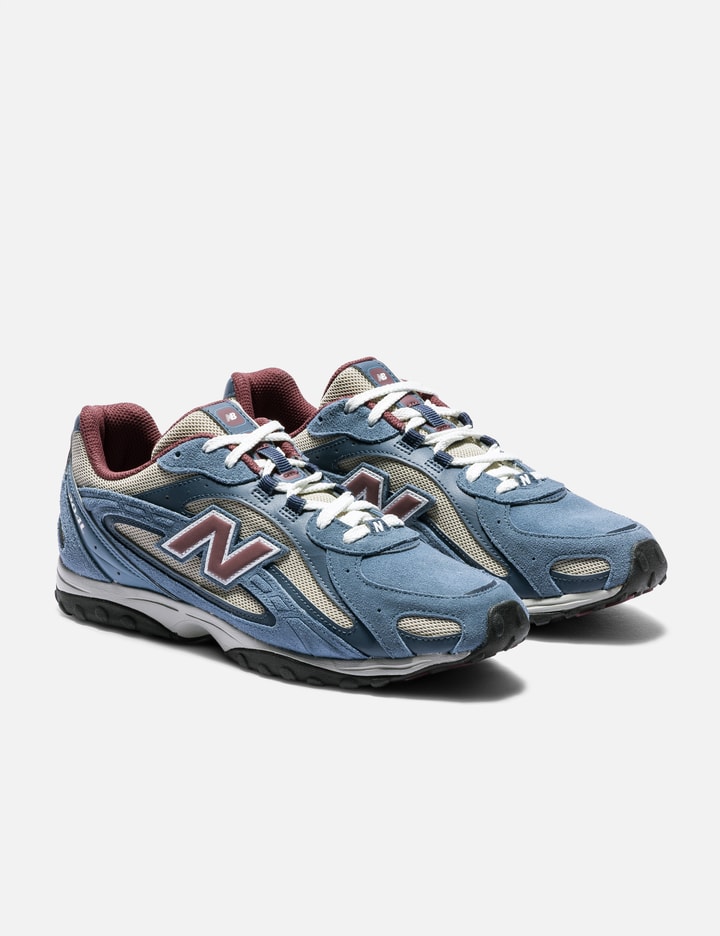 New Balance 204L - Retro washed mesh & suede sneaker in Blue/True Red | HBX