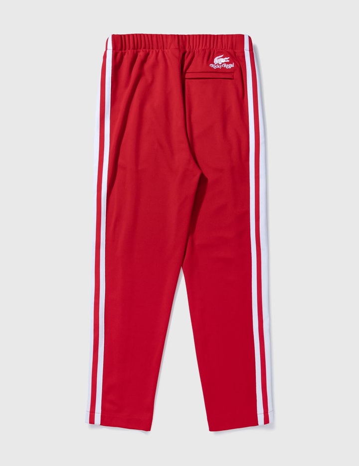 Lacoste - LACOSTE X RICKY REGAL TRACKPANTS | HBX - HYPEBEAST 為您搜羅全球潮流時尚品牌